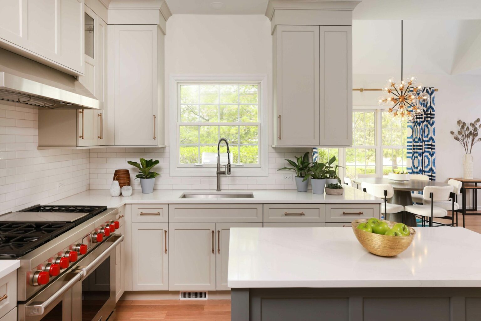 Warm White Kitchen with Two Gray Islands